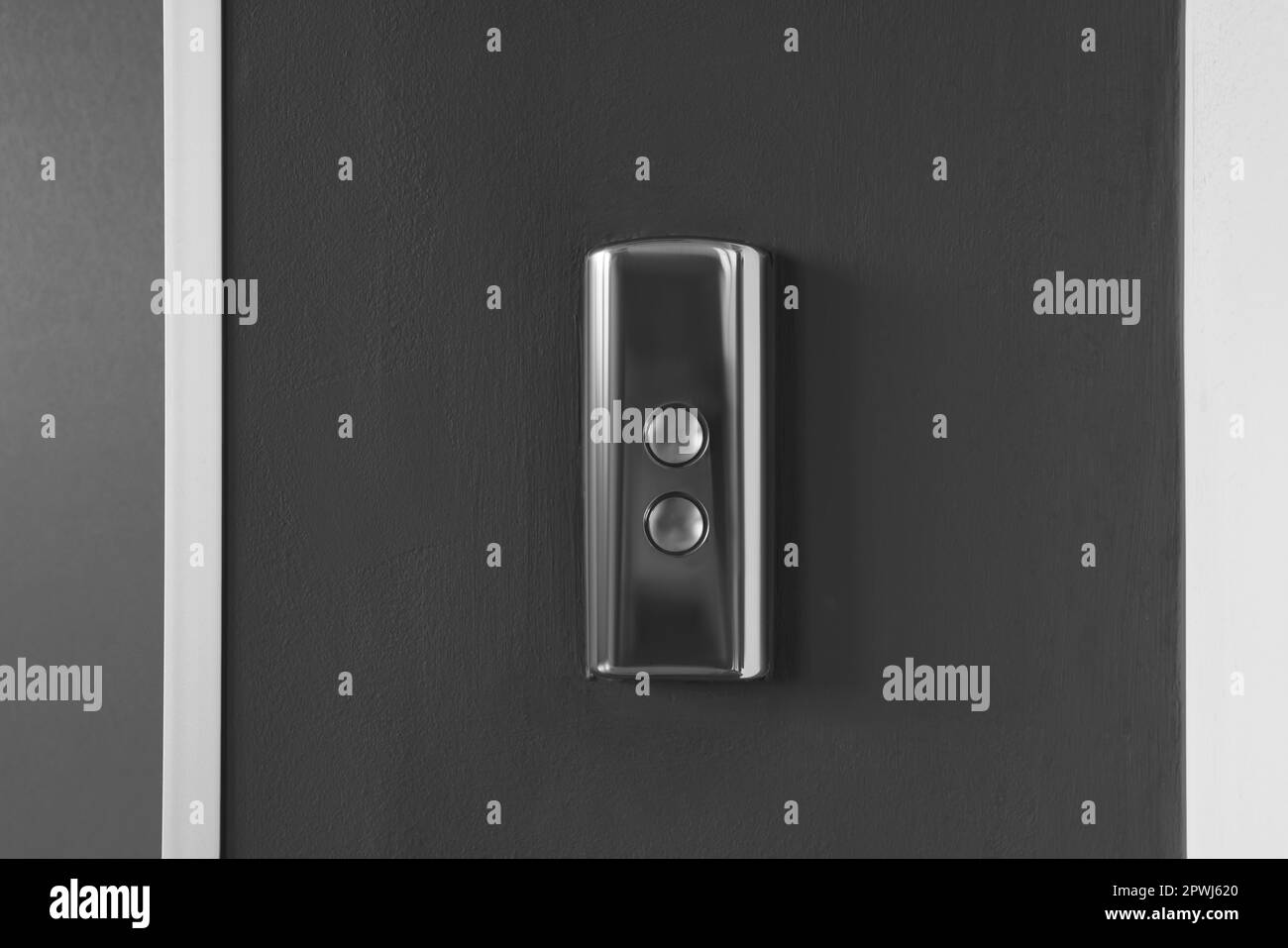 Elevator call buttons on grey wall, closeup Stock Photo - Alamy