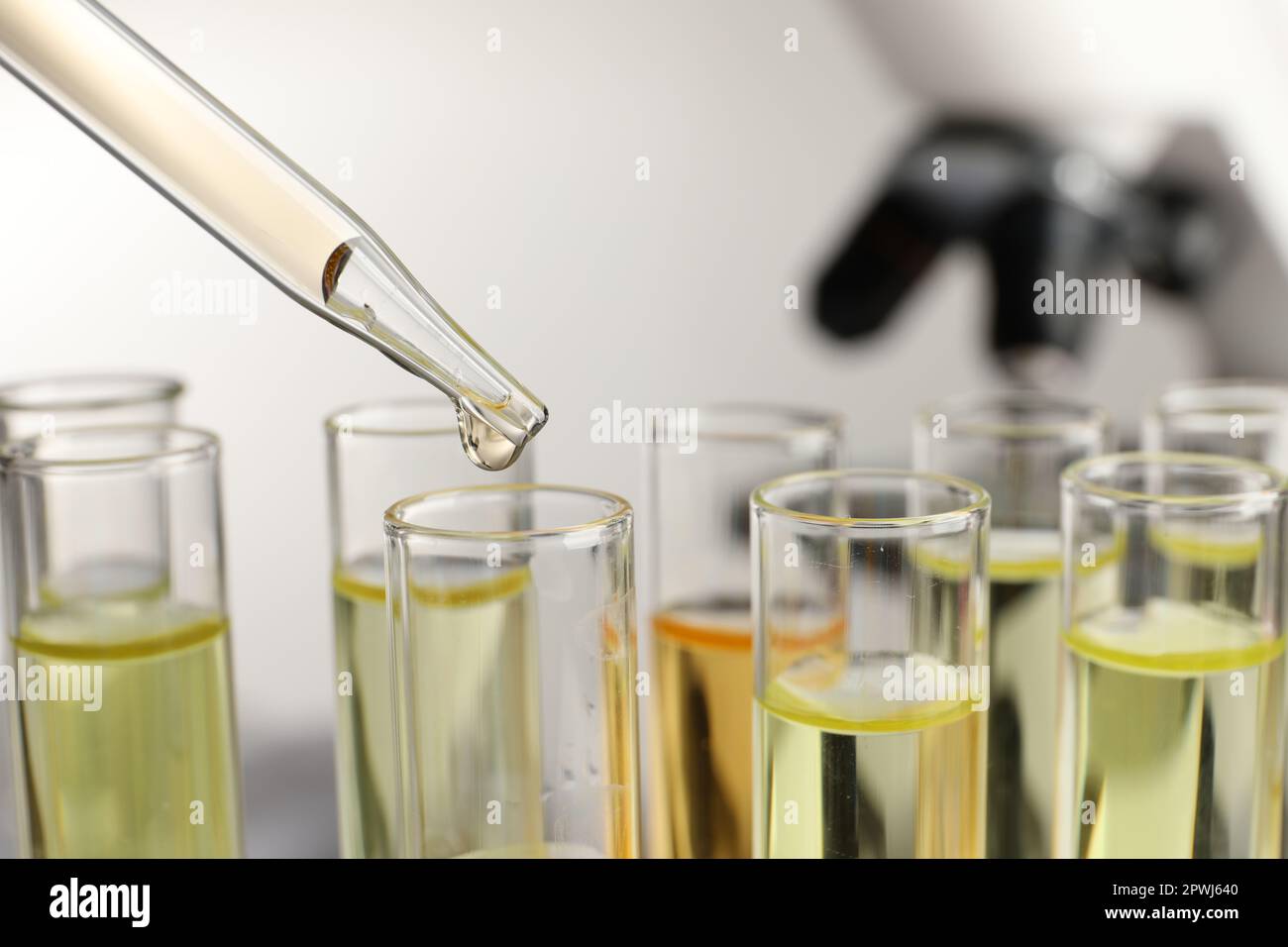 Dropping urine sample for analysis into tube, closeup Stock Photo - Alamy