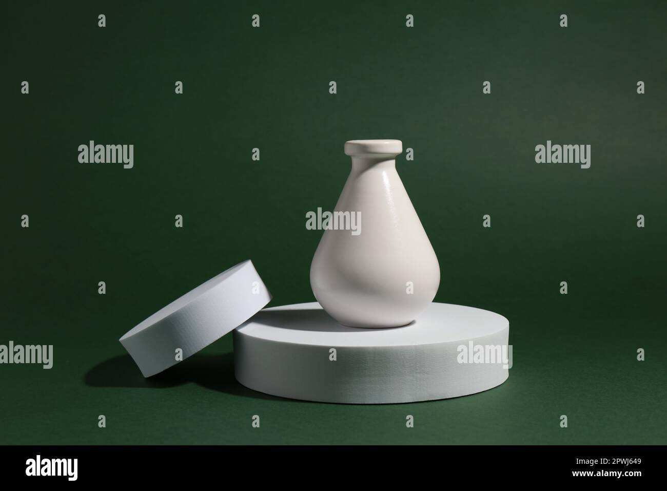 Product photography props. Round shaped podiums and vase on green ...