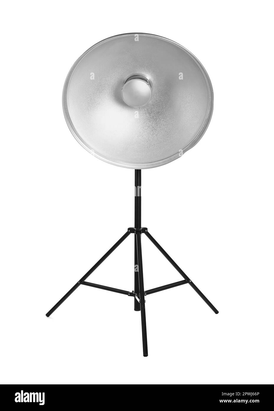 Studio flash light with reflector on tripod against white background ...