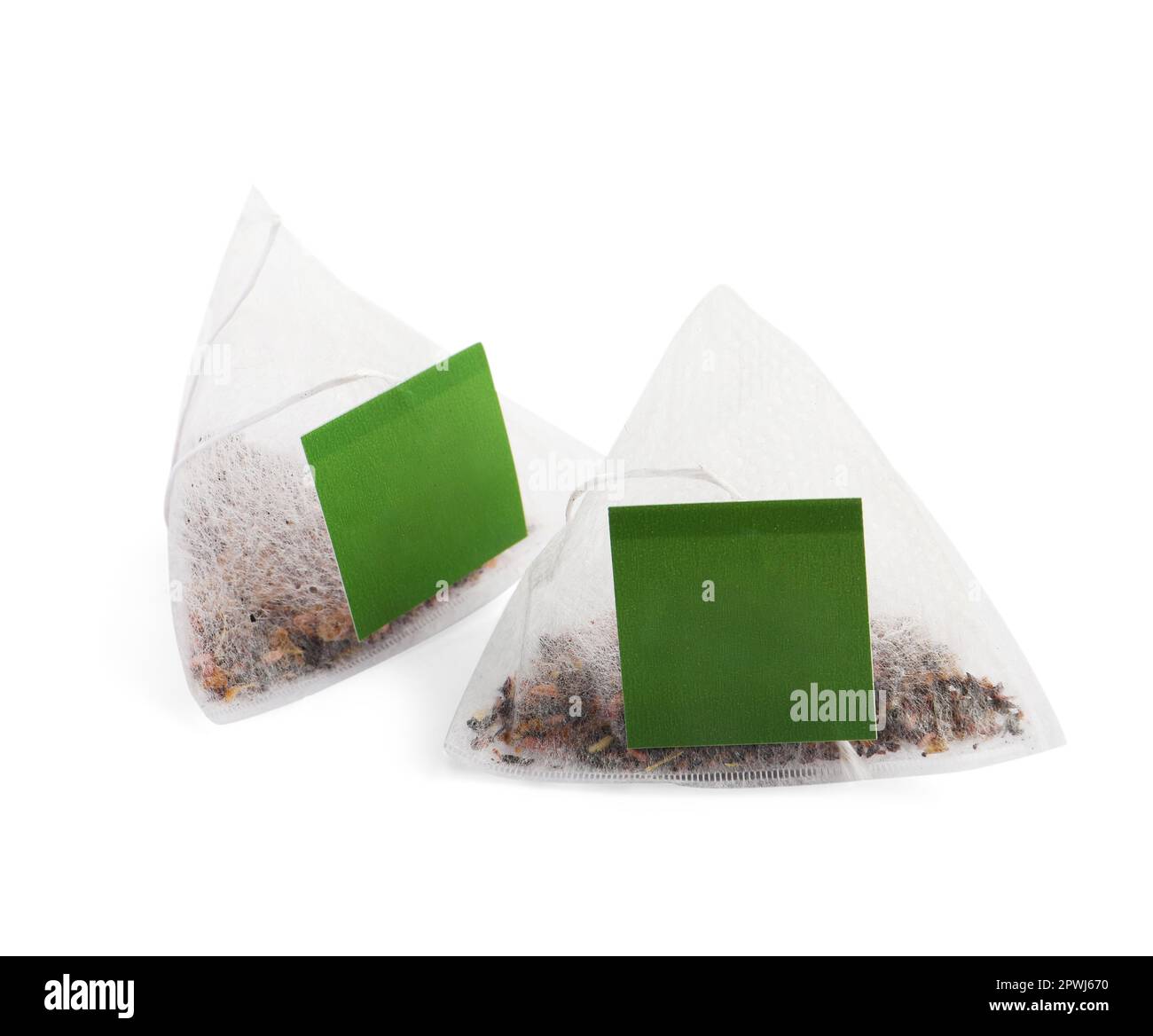 New pyramid tea bags on white background Stock Photo - Alamy