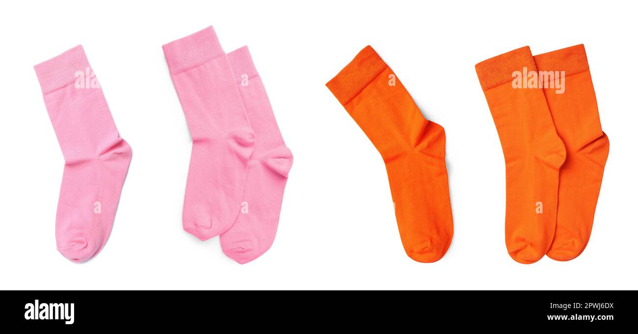 Set with pairs of different color socks on white background, top view ...