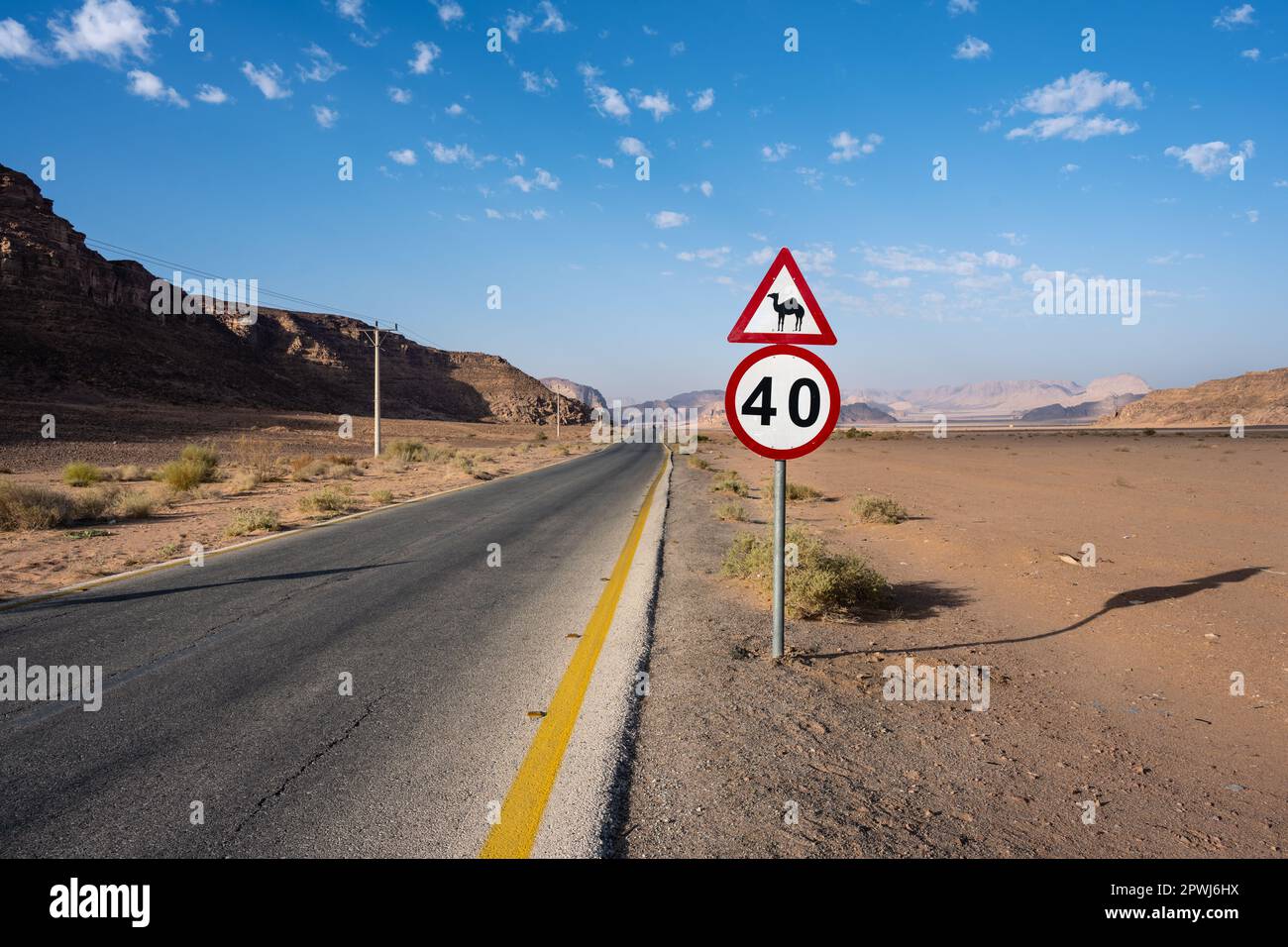 Attention Camel and 40 kmh Road Sign on the Wadi Rum Road in the Desert ...