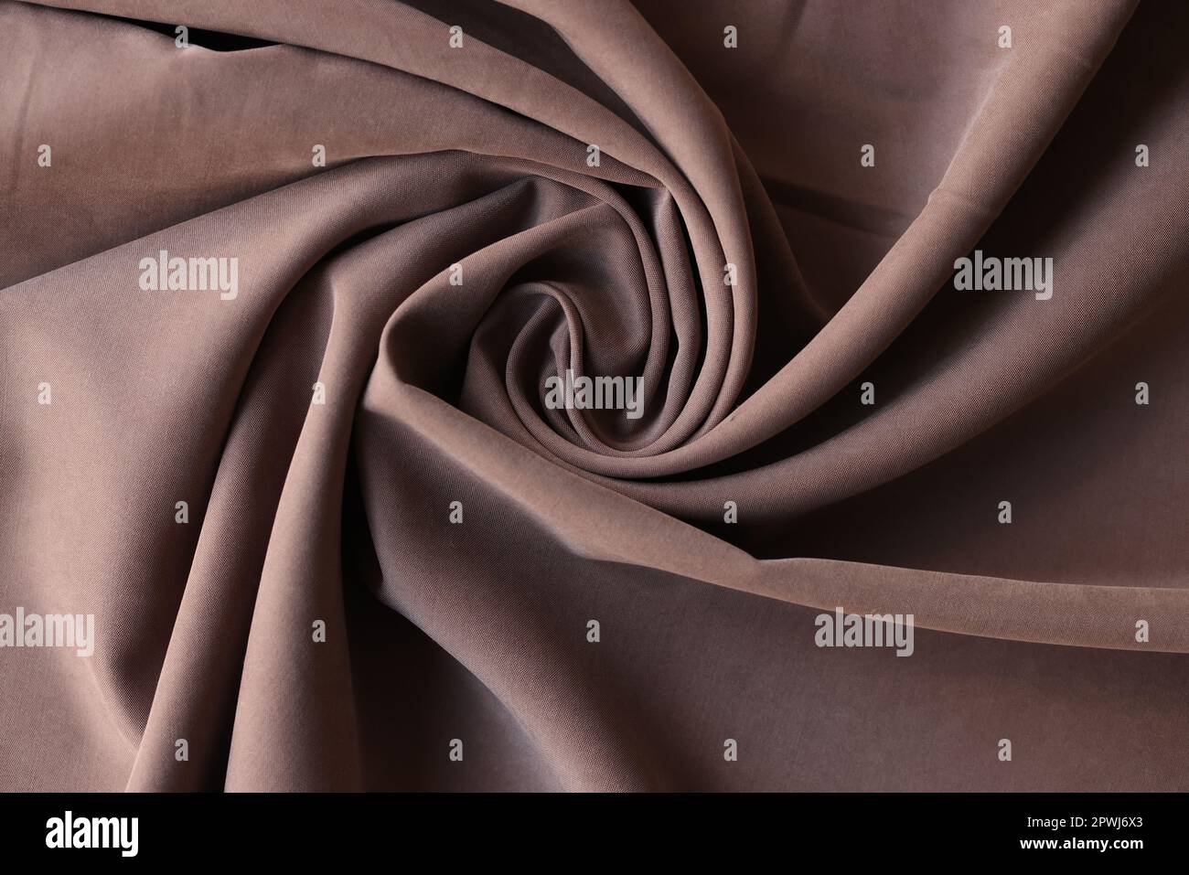 Twisted brown textile with creases for curtain production Stock Photo ...