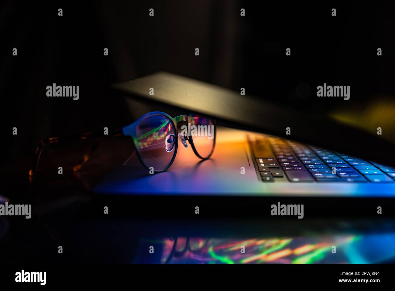 Laptop half closed in hi-res stock photography and images - Alamy