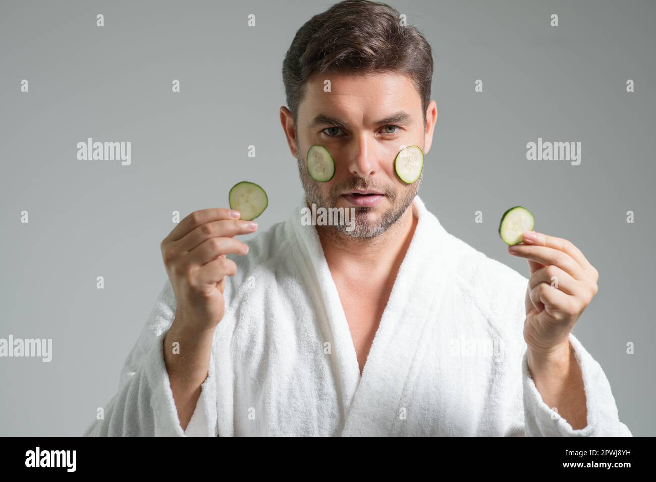 Beauty man hold cucumber. Middle aged man with cucumber isolated on ...