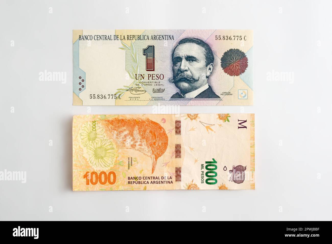 Two argentinian peso bills. One of one peso, printed in 1992, an ...