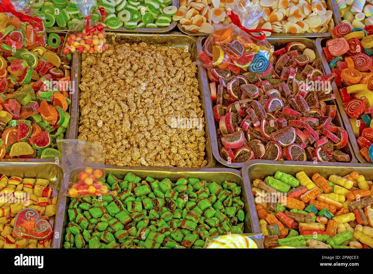Colorful foam and jelly candy piles on festive market Stock Photo - Alamy