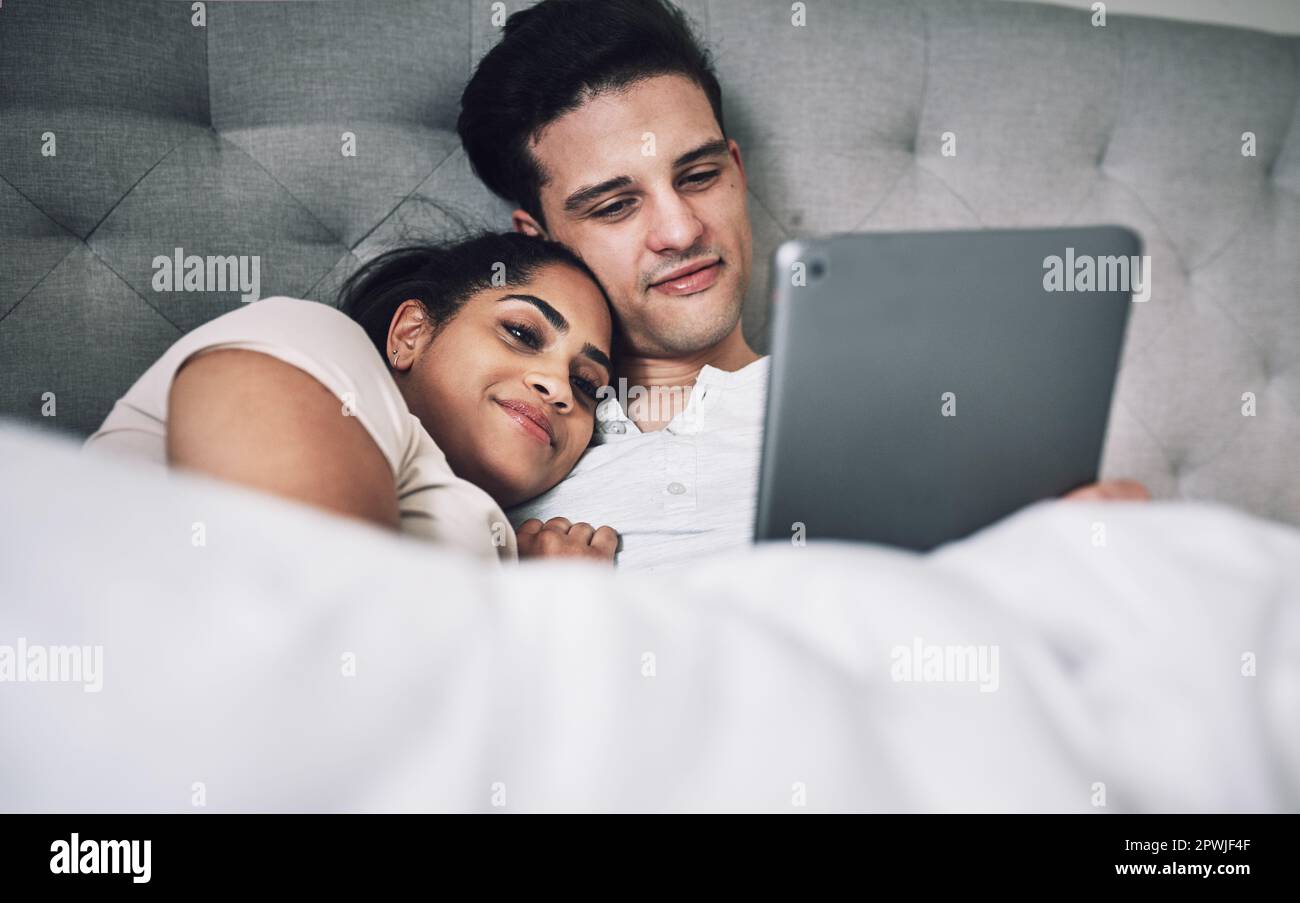 Lets watch another episode before we get up. a woman covering her ...