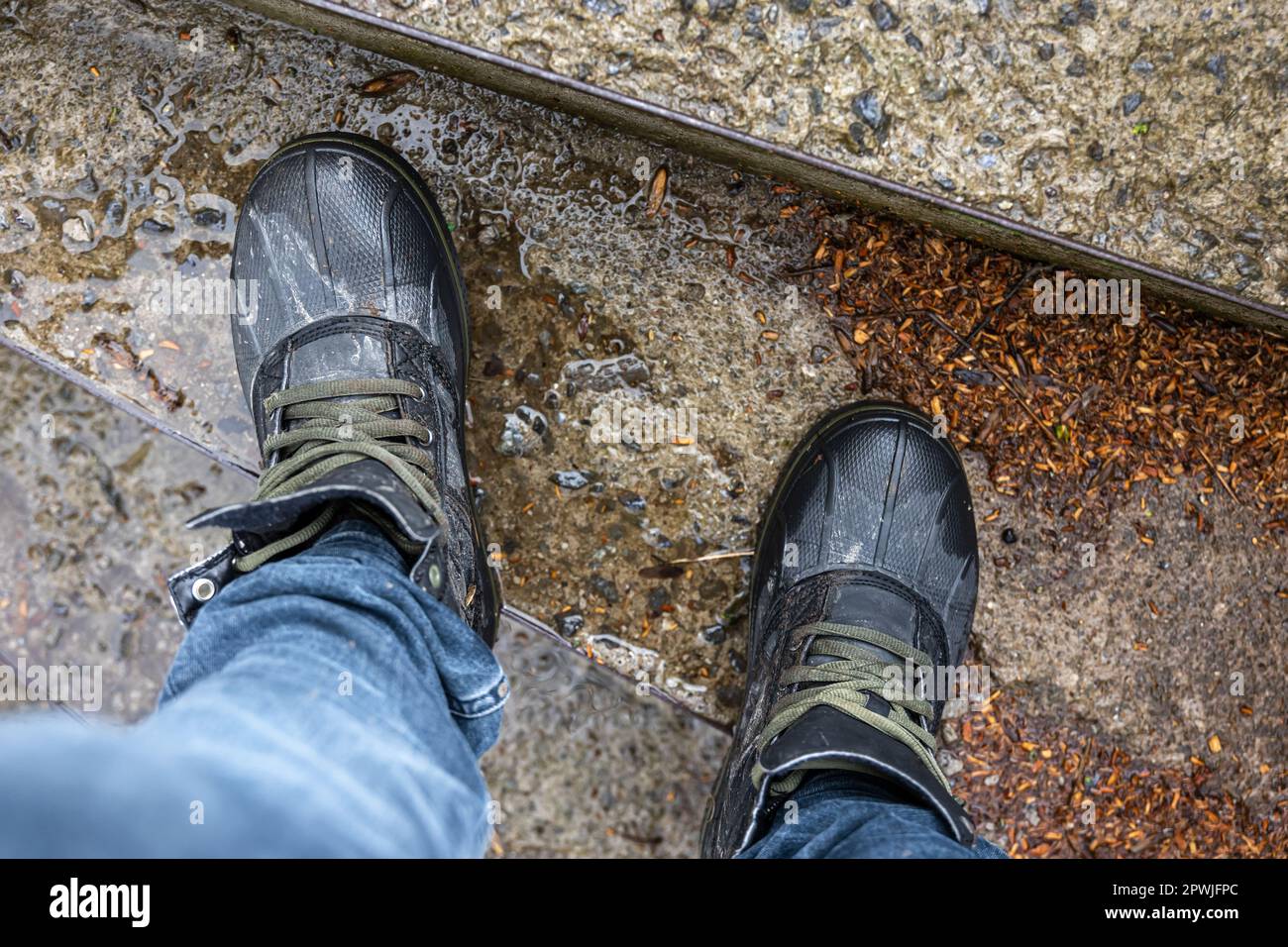 Pair of sneakers in mud hi-res stock photography and images - Alamy