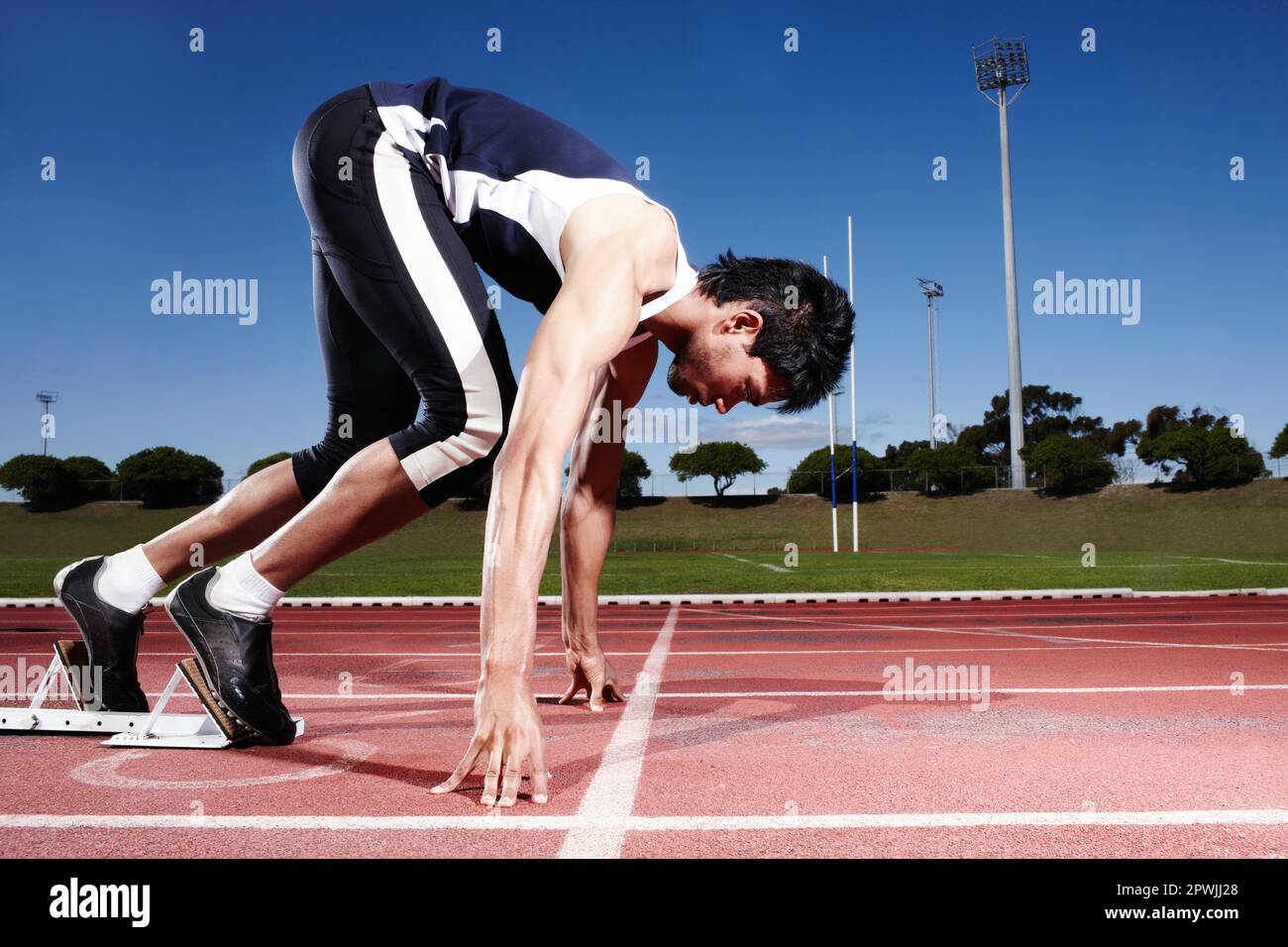 A young runner getting ready for a race Stock Photo - Alamy
