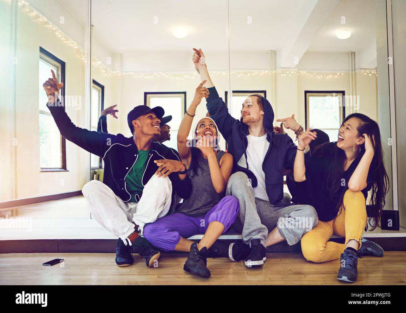 Mad love for their dance crew. a group of young friends hanging out in ...