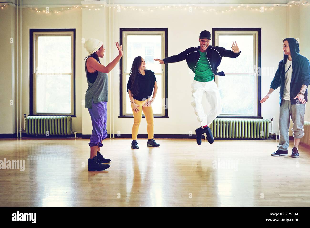Dancing is a full body experience. a group of young friends dancing ...
