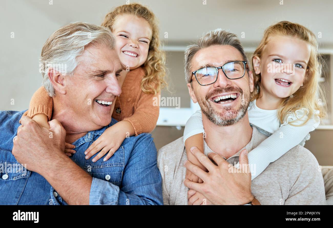 A happy multi generation family of four relaxing in the lounge and ...