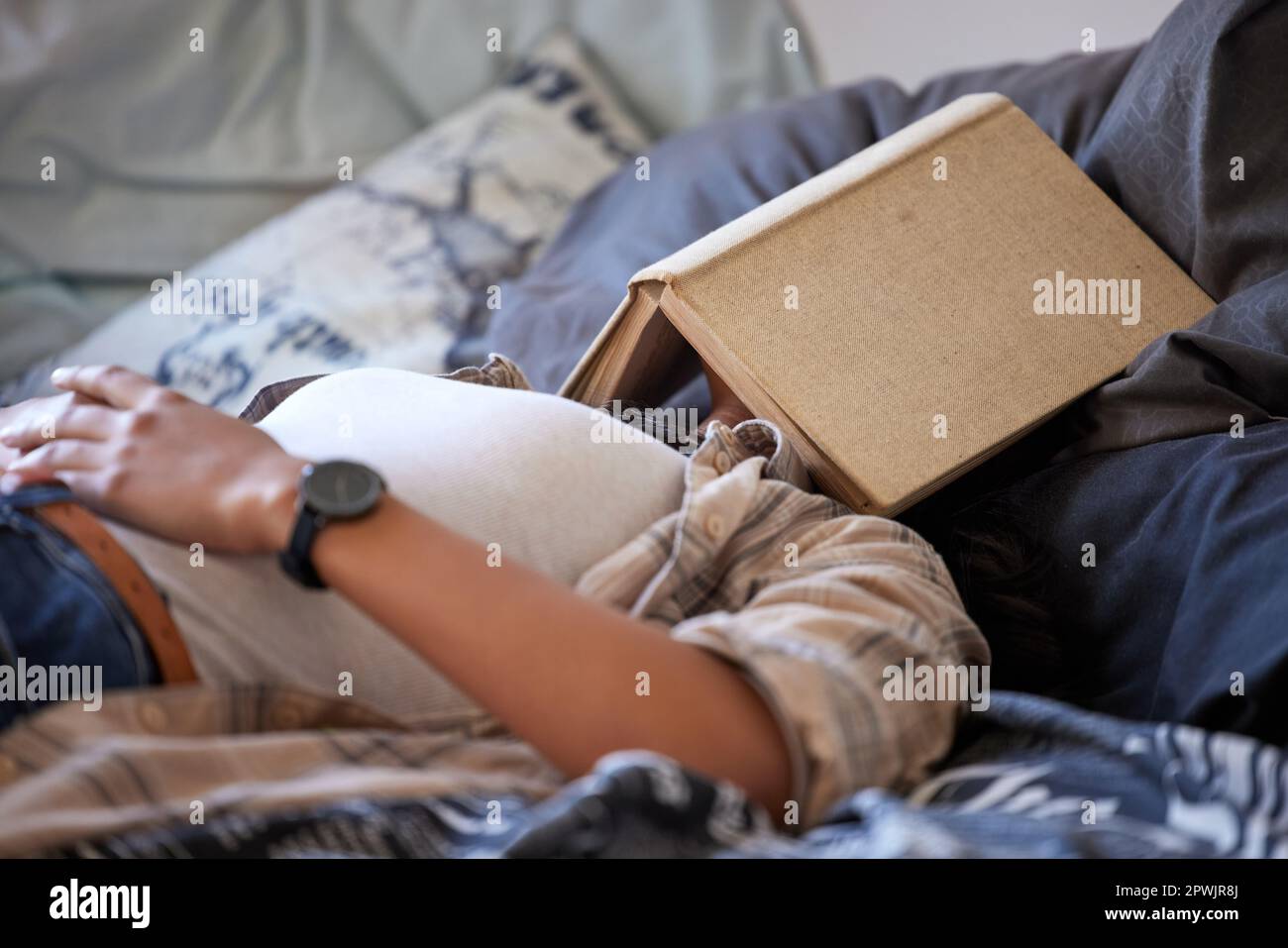 Just a quick nap. an unrecognizable student passed out while studying ...