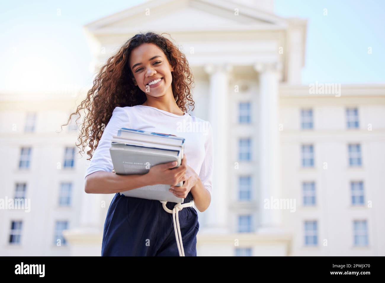 A calm and modest life brings more happiness. a young woman carrying ...