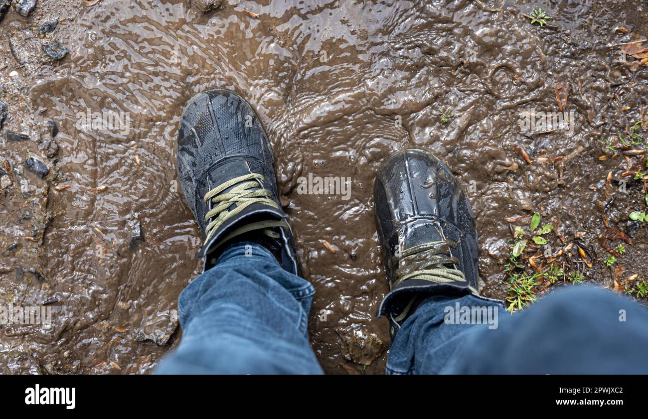 Pair of sneakers in mud hi-res stock photography and images - Alamy