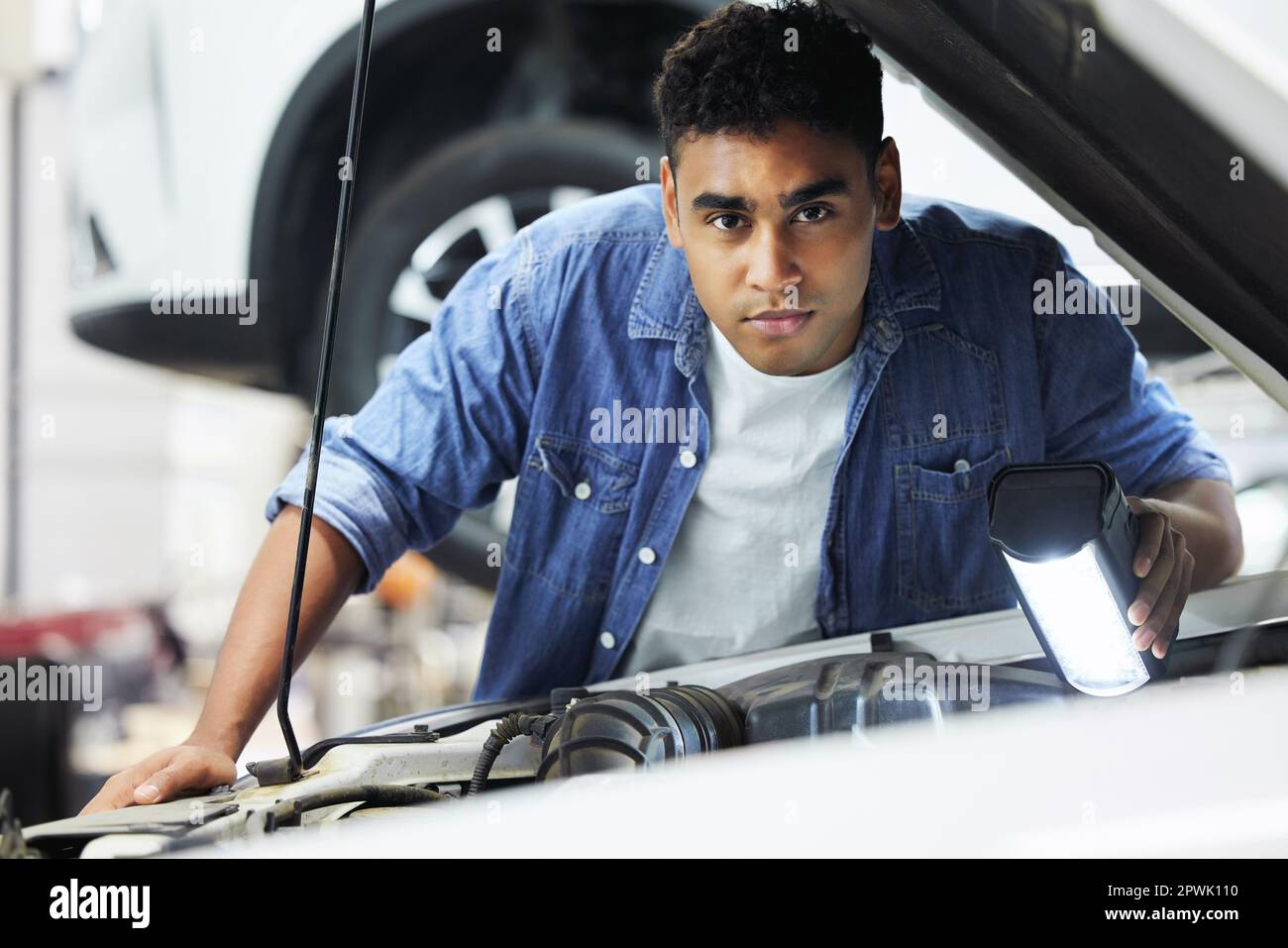 Just a simple manly man. Portrait of a handsome young male mechanic ...