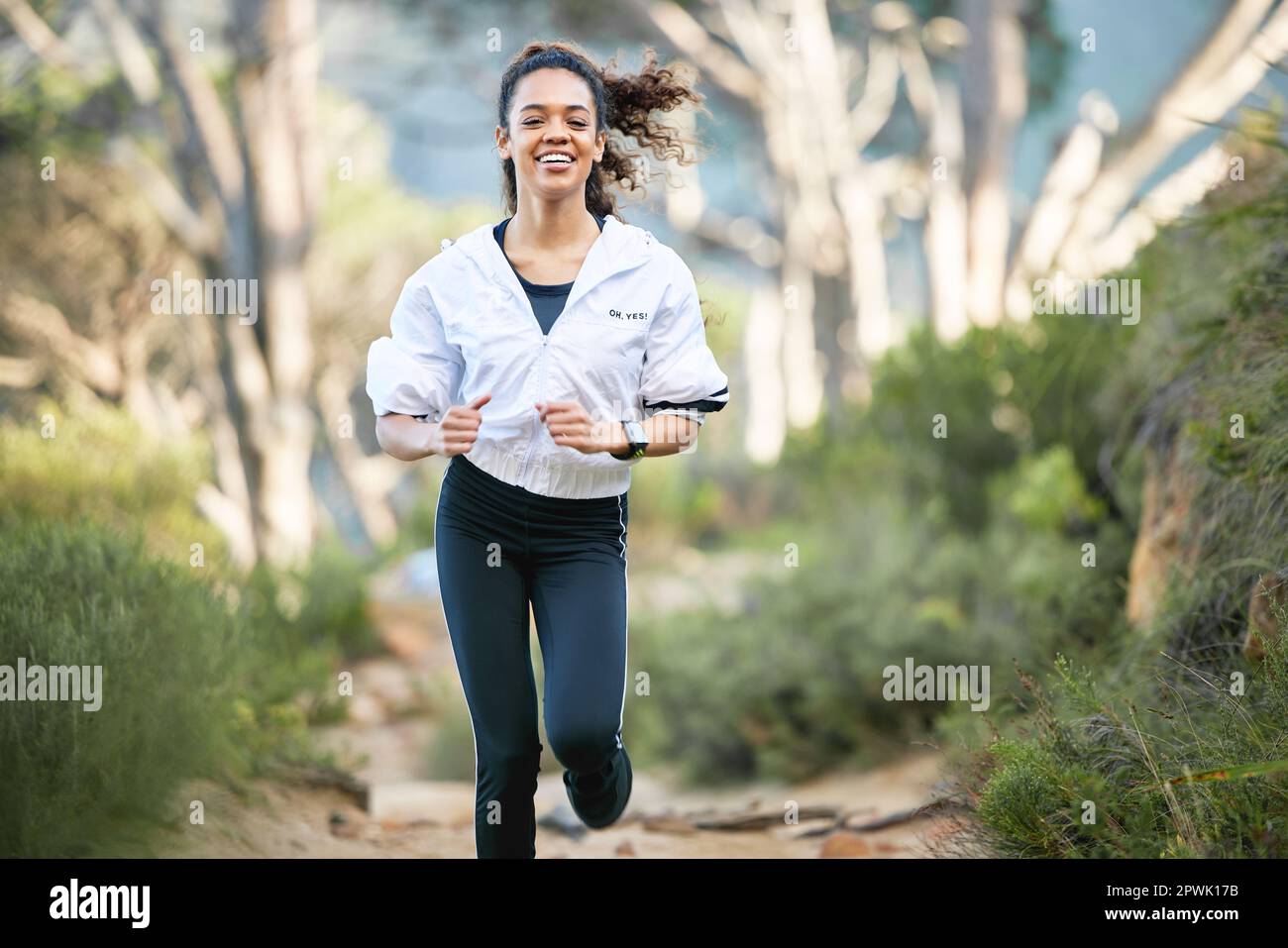 Shes ready to get moving. a young woman going for a run Stock Photo - Alamy