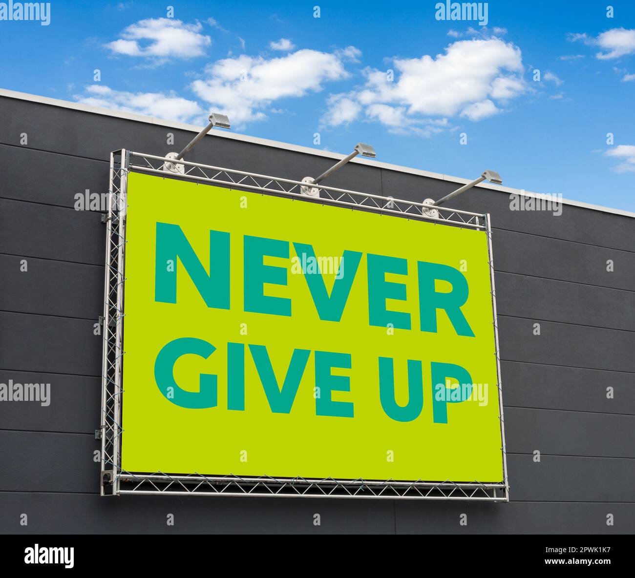 Never give up written on a billboard Stock Photo - Alamy