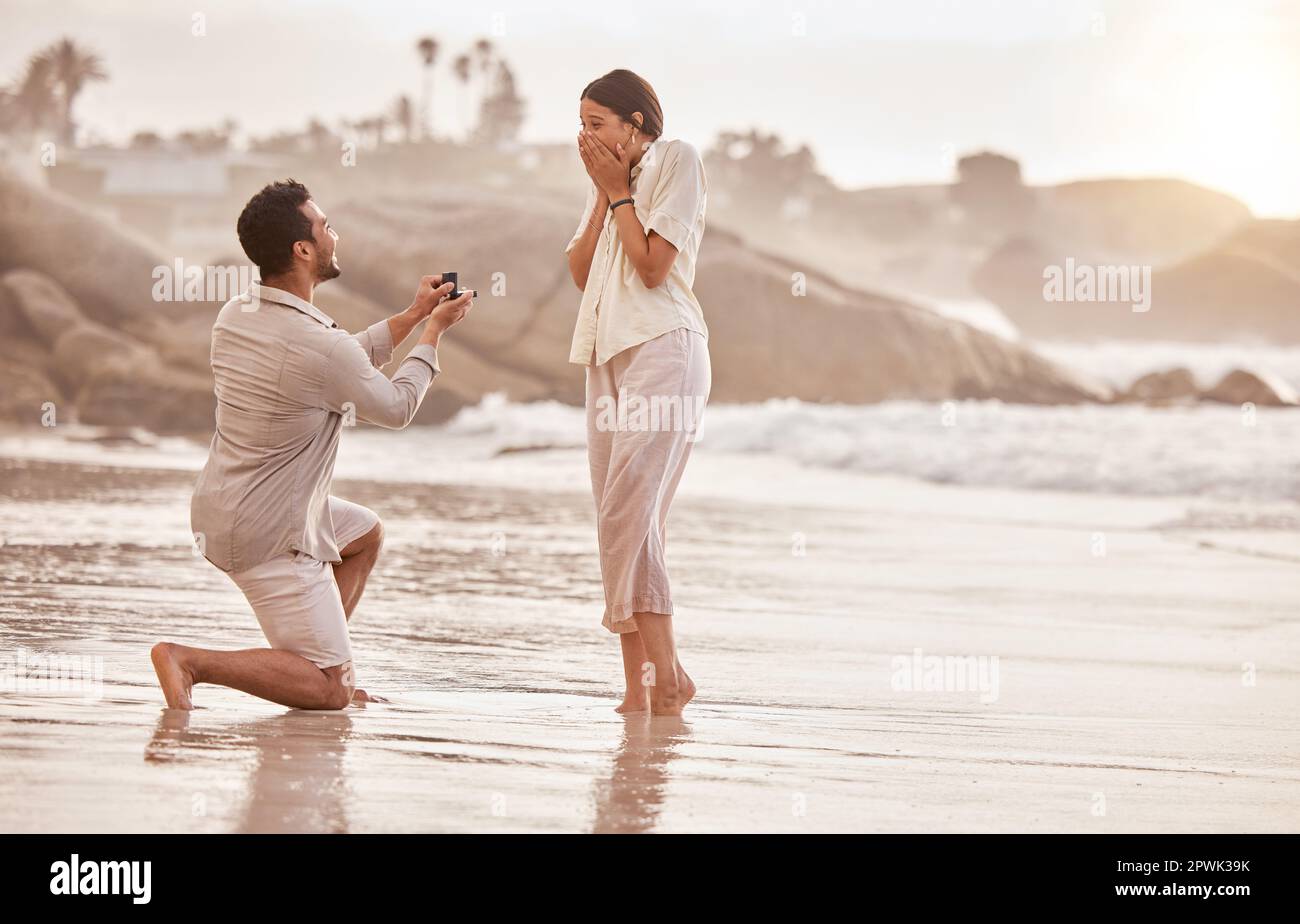 Make me the happiest man alive by saying yes. a young man proposing to ...