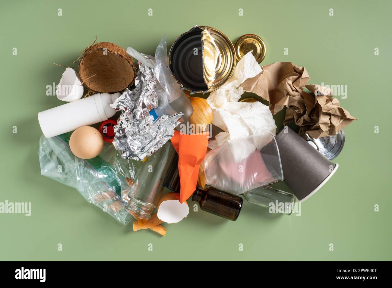 Big messy pile of non sorted waste of plastic, metal, foil, organic ...