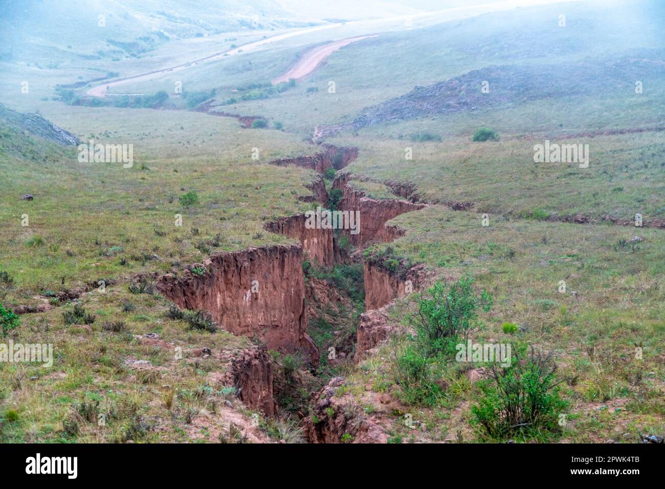 a large crack in the ground after seismic activity Stock Photo - Alamy