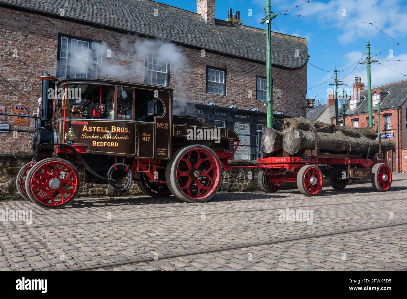 A vintage steam tractor pulling a trailer of logs. Pictured at Beamish ...