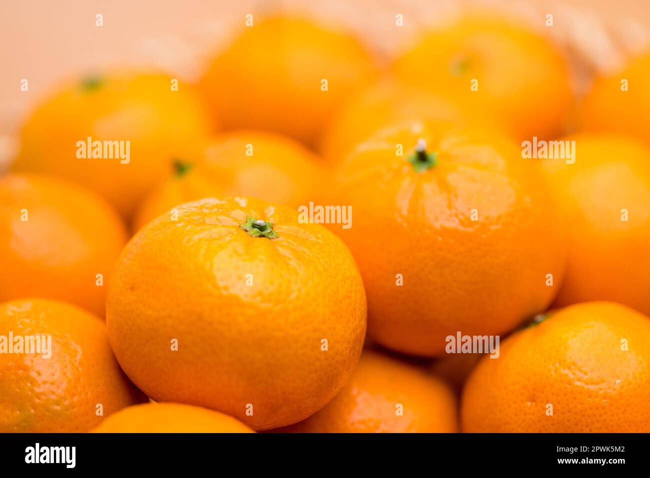 Stack of citrus fruit on basket Stock Photo - Alamy