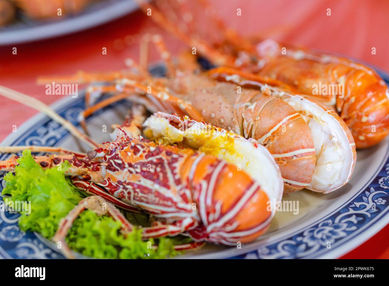 Seafood steamed lobster in vegetable decoration Stock Photo - Alamy