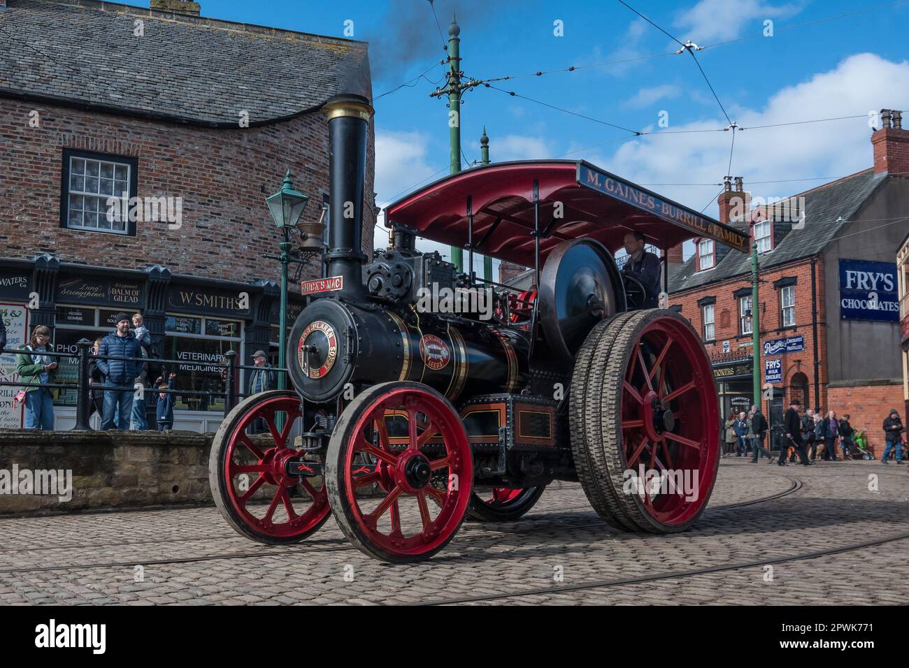 A vintage steam traction engine moving along a cobbled road. Pictured ...