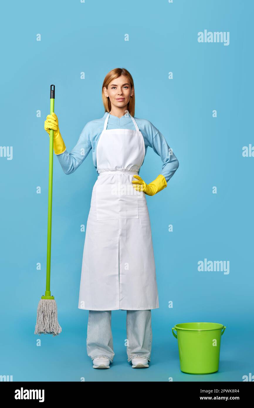 professional cleaner blonde woman in rubber gloves and cleaner apron ...