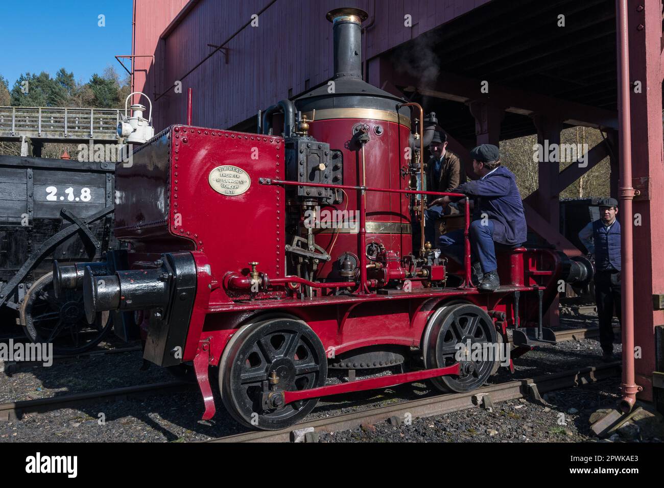 A coffeepot steam locomotive shunts wagons in a Victorian colliery ...