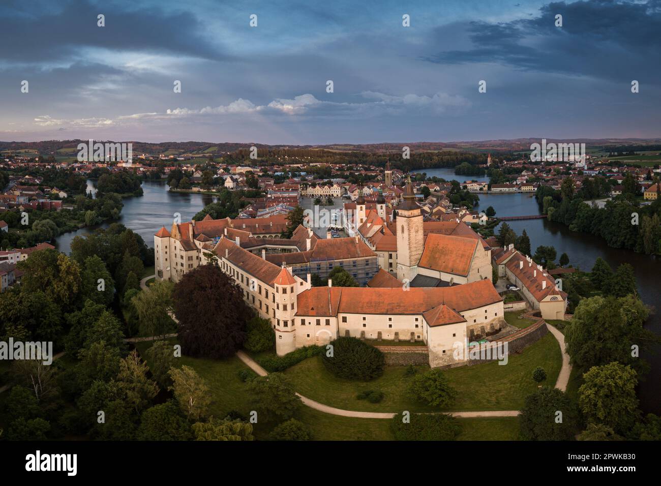 Aerial view just after sunrise of the pond and bridge in front of the ...