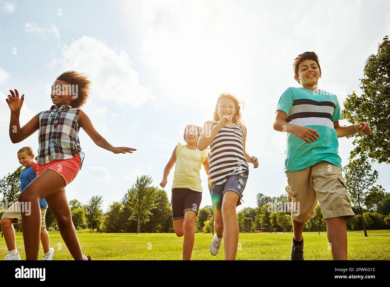 Friends having some endless fun. a group of diverse and happy kids ...