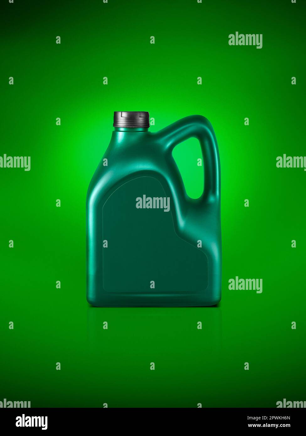 Gallon of engine oil on a dark green background Stock Photo - Alamy