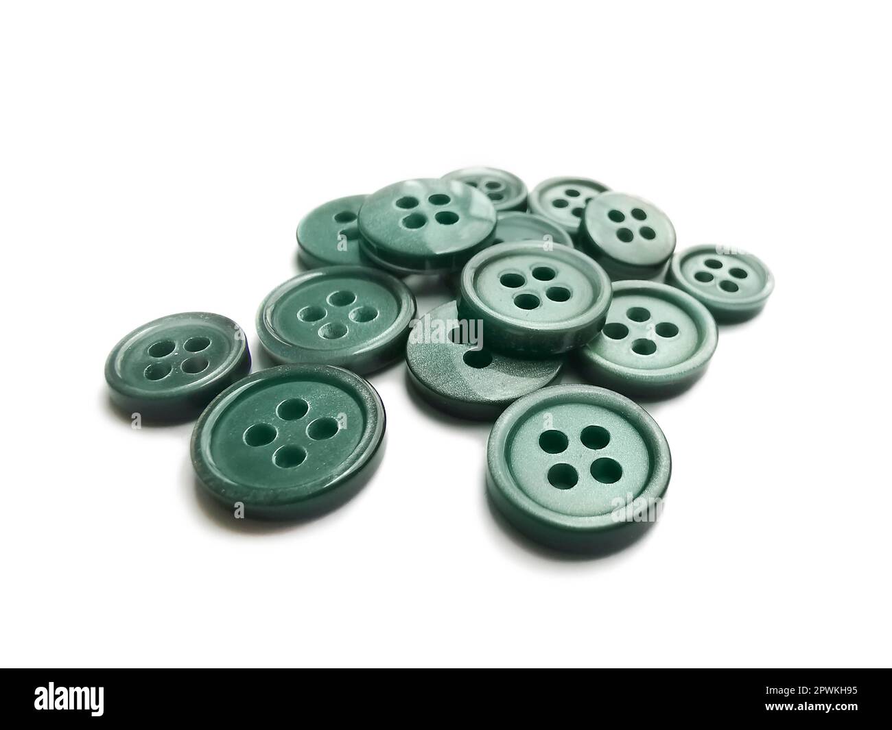 clothing buttons on white background Stock Photo - Alamy