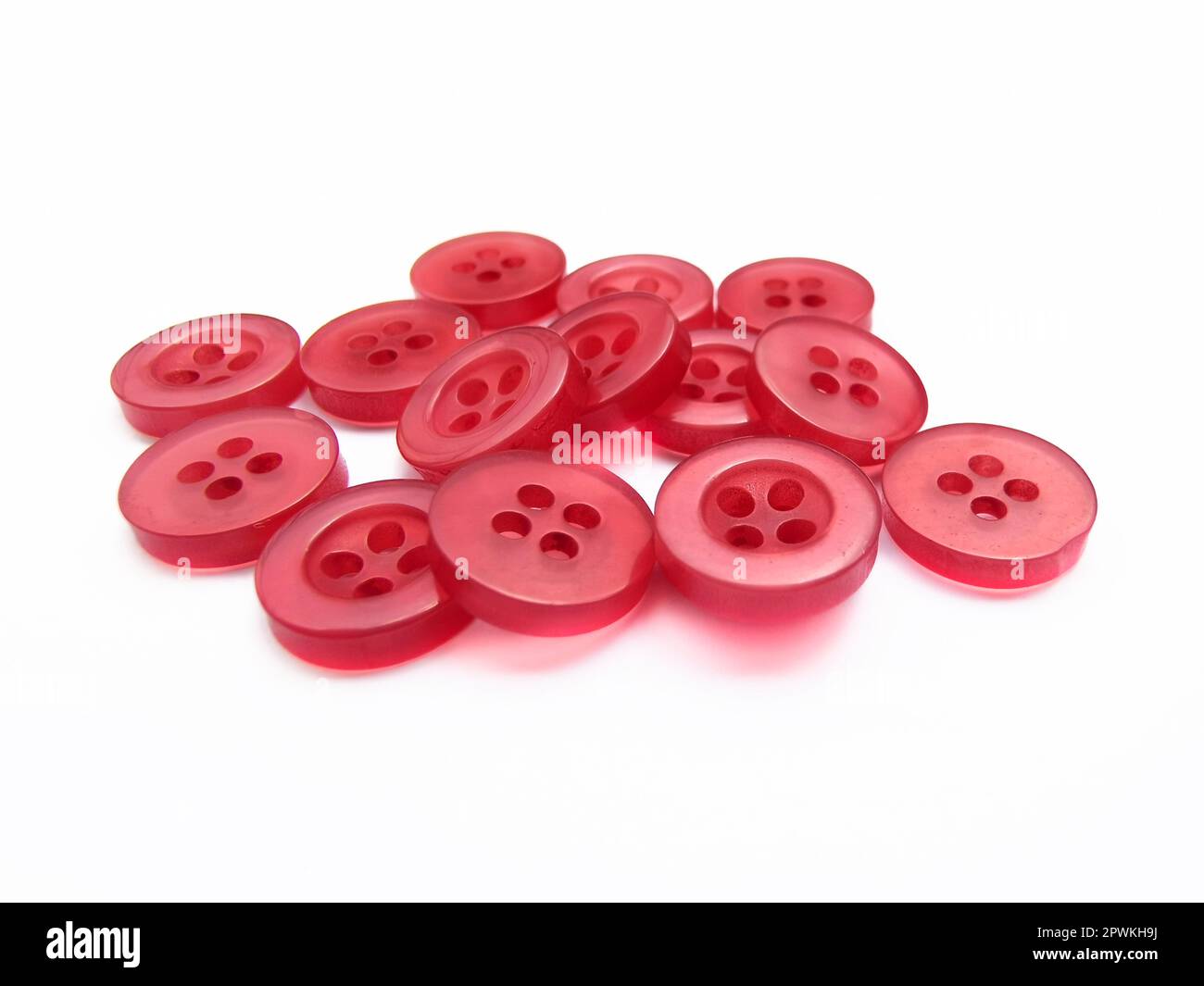 clothing buttons on white background Stock Photo - Alamy