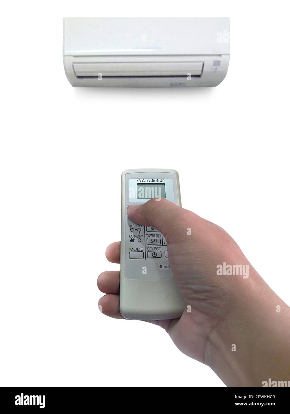 Hand holding the remote control to control the air conditioning ...