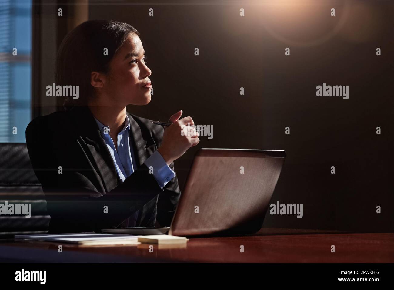 To be successful, you must think big. a young woman contemplating while ...