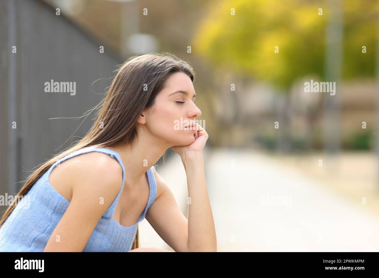 Teen relaxing with closed eyes in a park Stock Photo - Alamy