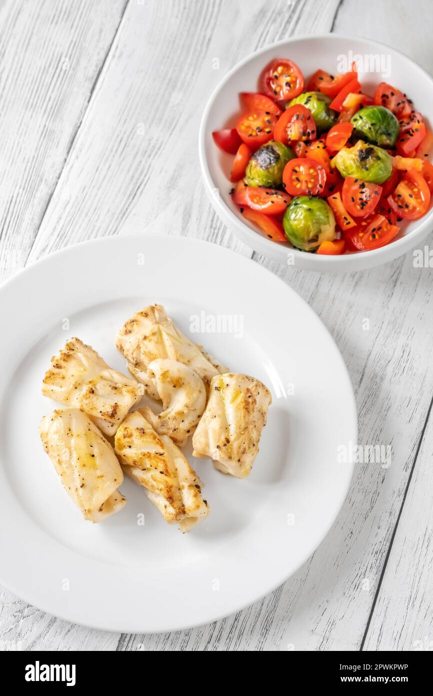 Portion of fried asian style calamari on the plate Stock Photo - Alamy