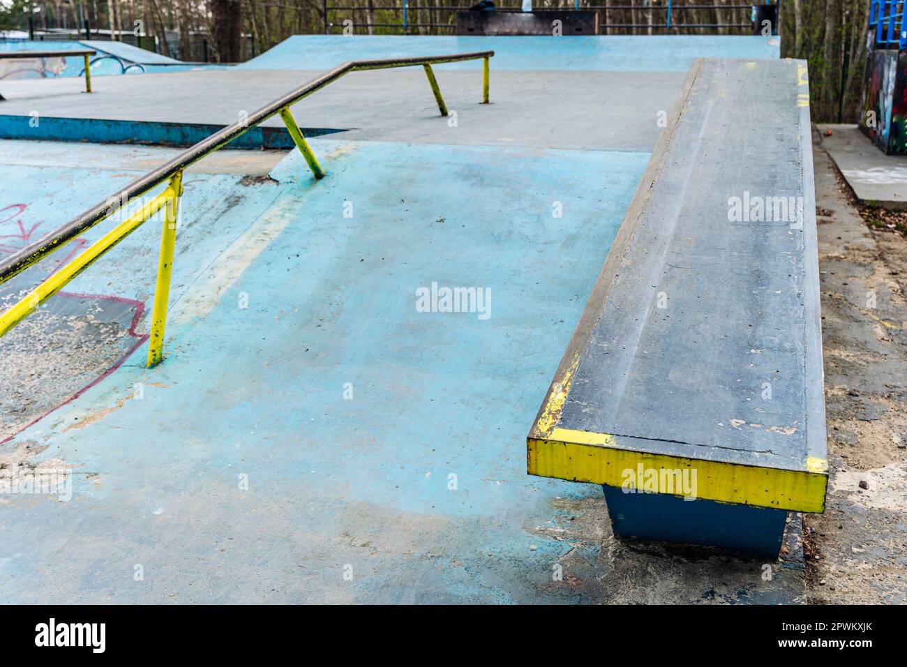 a ramp with an iron ramp for jumping in a skate park Stock Photo - Alamy