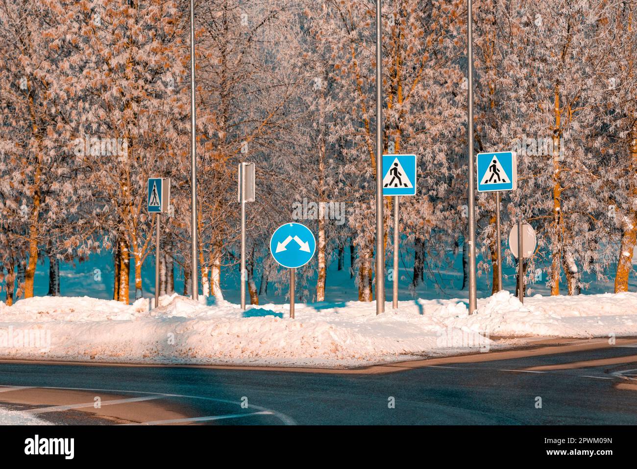 The image of a winter street with a lot of traffic signs. Intersection ...