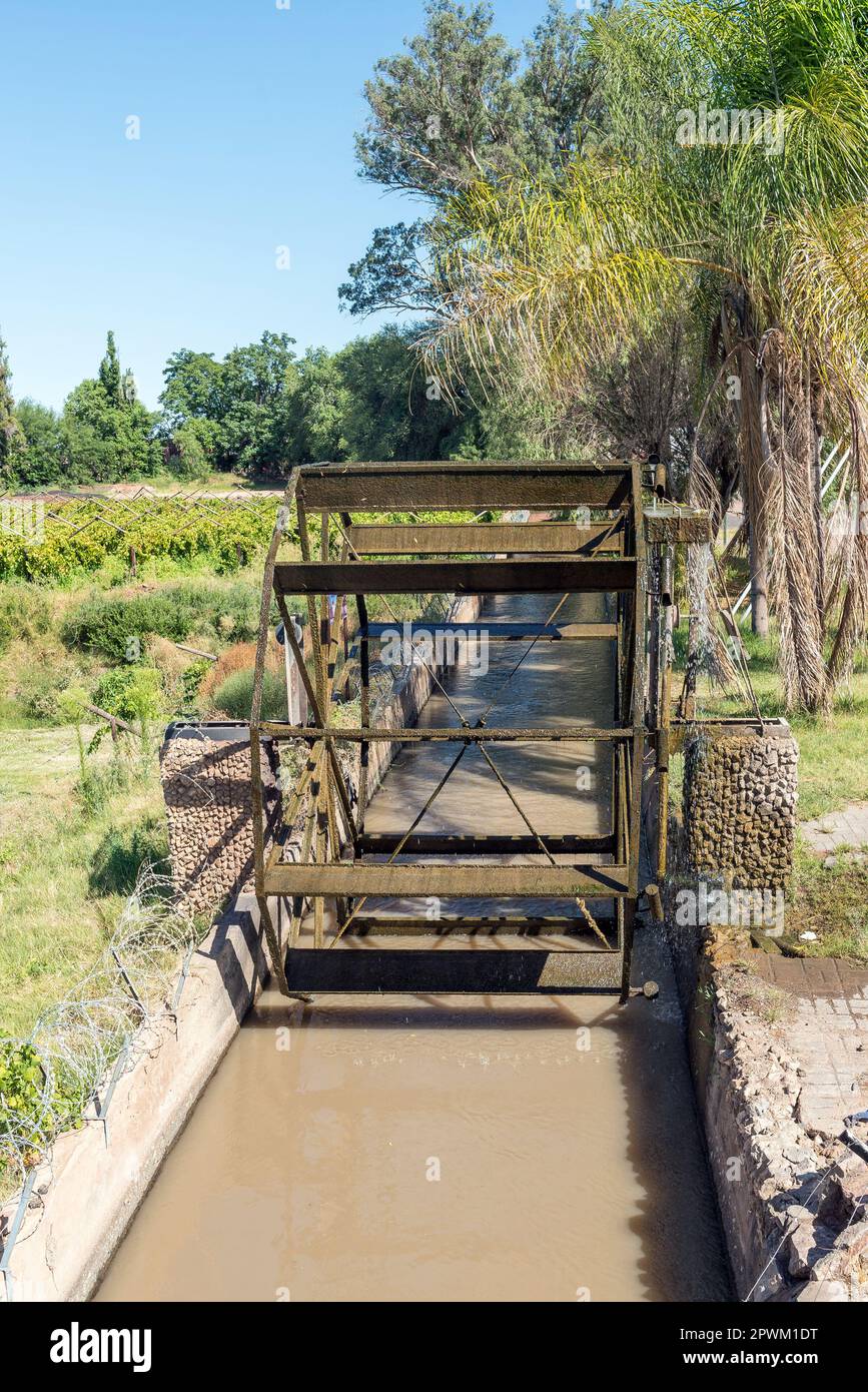 An irrigation canal and working waterwheel replica in Keimoes in the ...