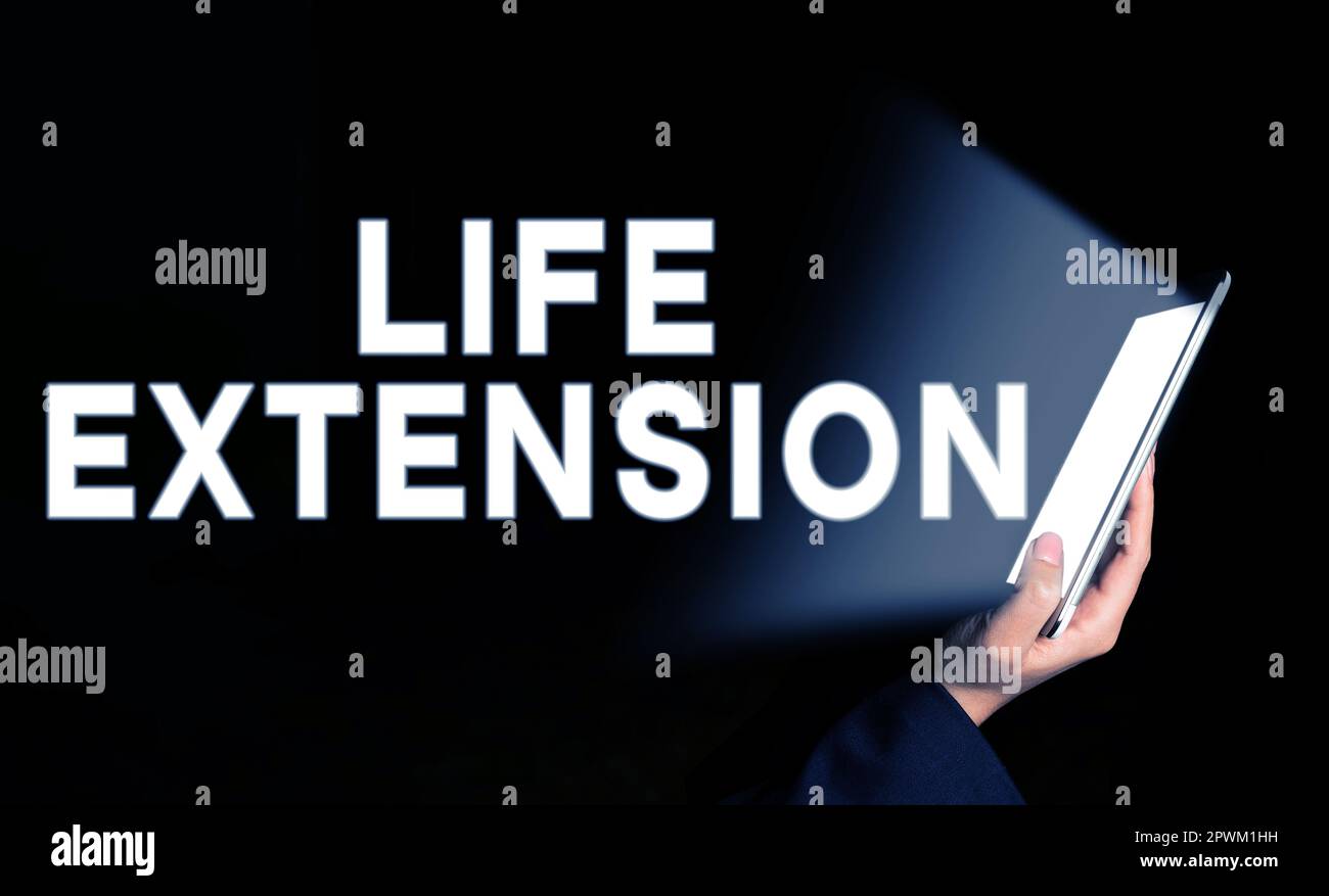 Sign displaying Life Extension, Business showcase able to continue ...