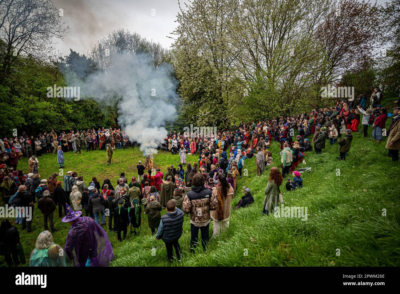 People watch the Beltane ceremony at Chalice Well, Glastonbury ...