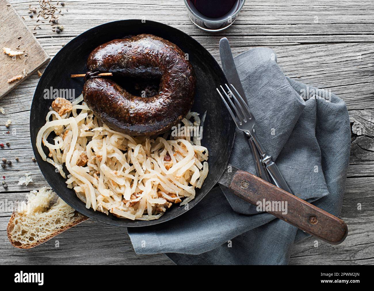 Bloody sausage morcilla and stewed sour turnip close up. Traditional ...