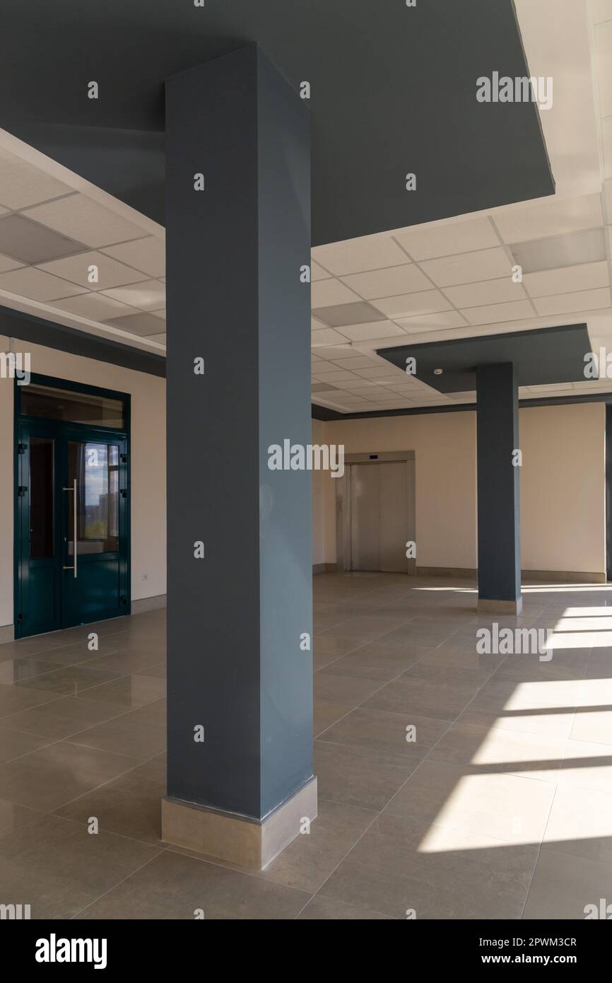 A large, spacious, empty room with huge windows and floor-mounted ...