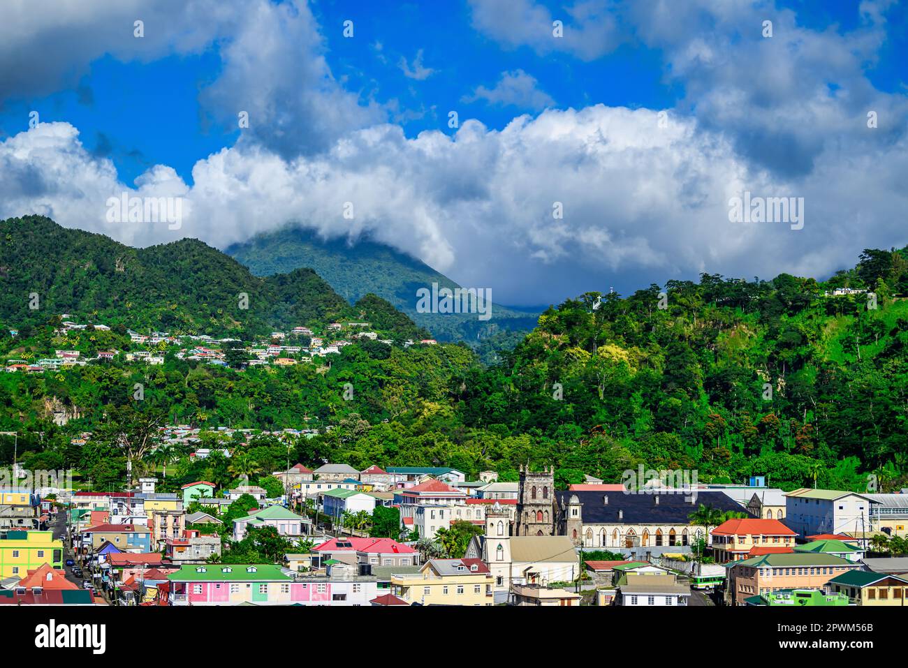 A view of the coast of Dominica and the jungle under a blue sky with ...